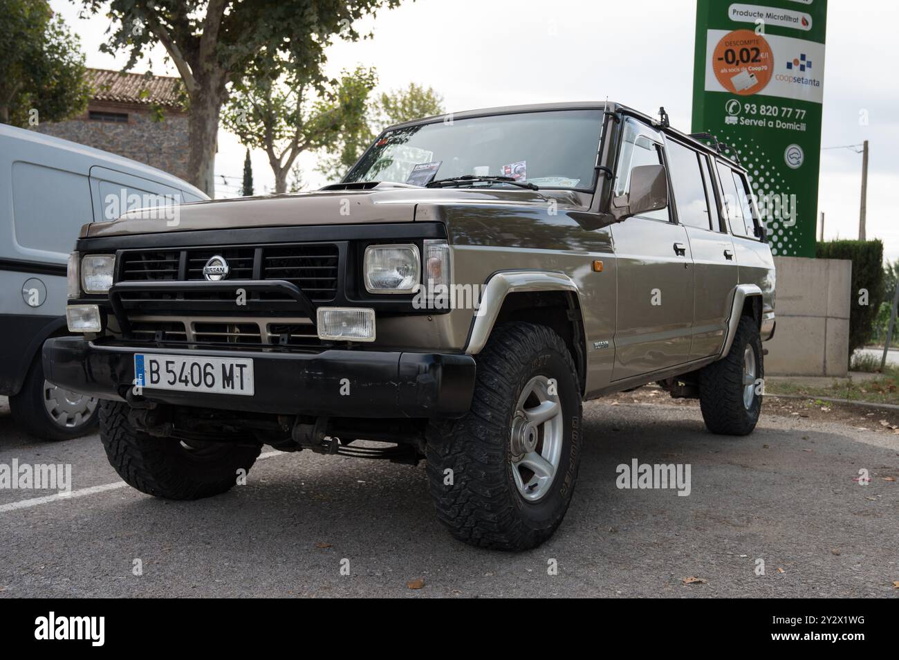 Front view of the classic third-generation brown two-tone Nissan Patrol ...