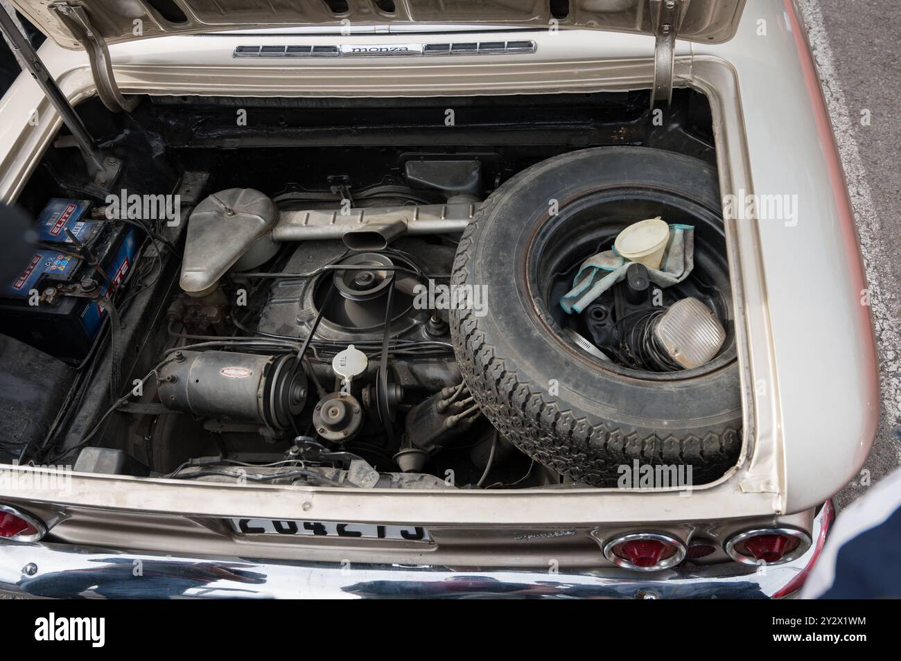 Engine compartment detail of an old Chevrolet Corvair Monza. It is a ...