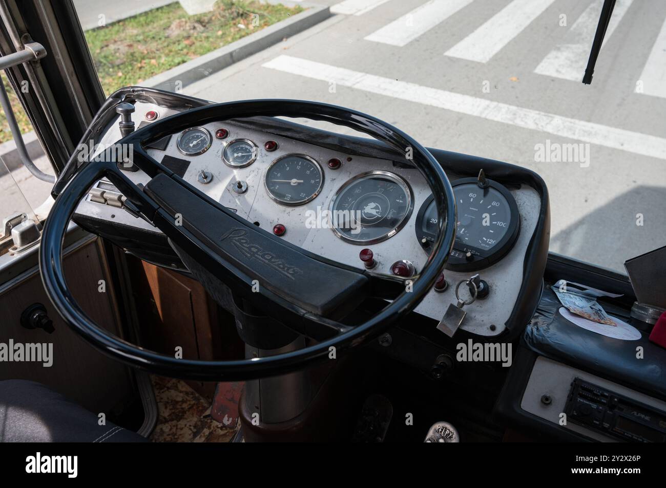 Interior and cockpit of the driver's position of an old classic bus or ...