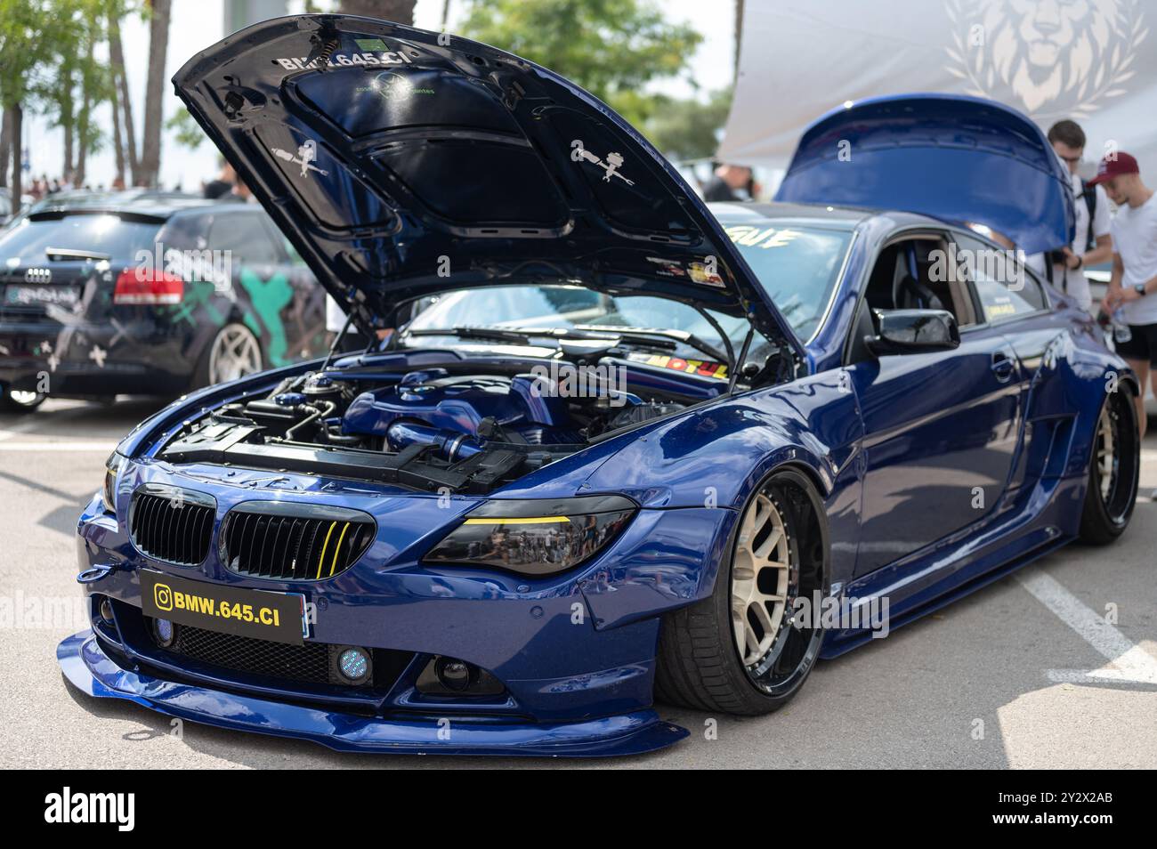 Spectacular tuned blue BMW 6 series 645ci with the hood open showing ...