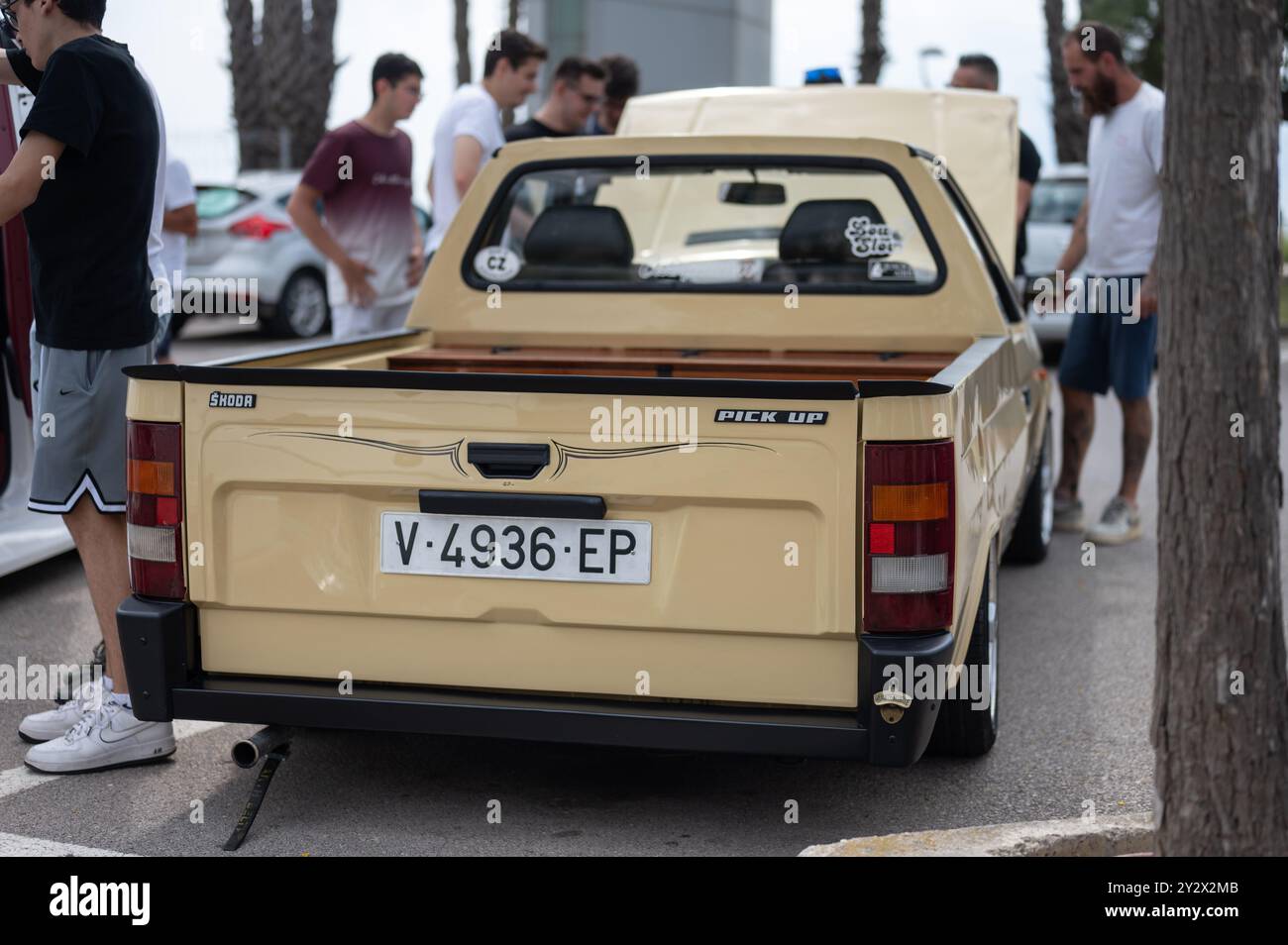 old tuned Skoda Favorit pickup truck at a car meeting. It is cream ...