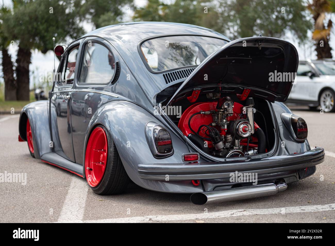 Rear view classic Volkswagen Type 1 nicknamed Beetle with the hood open ...