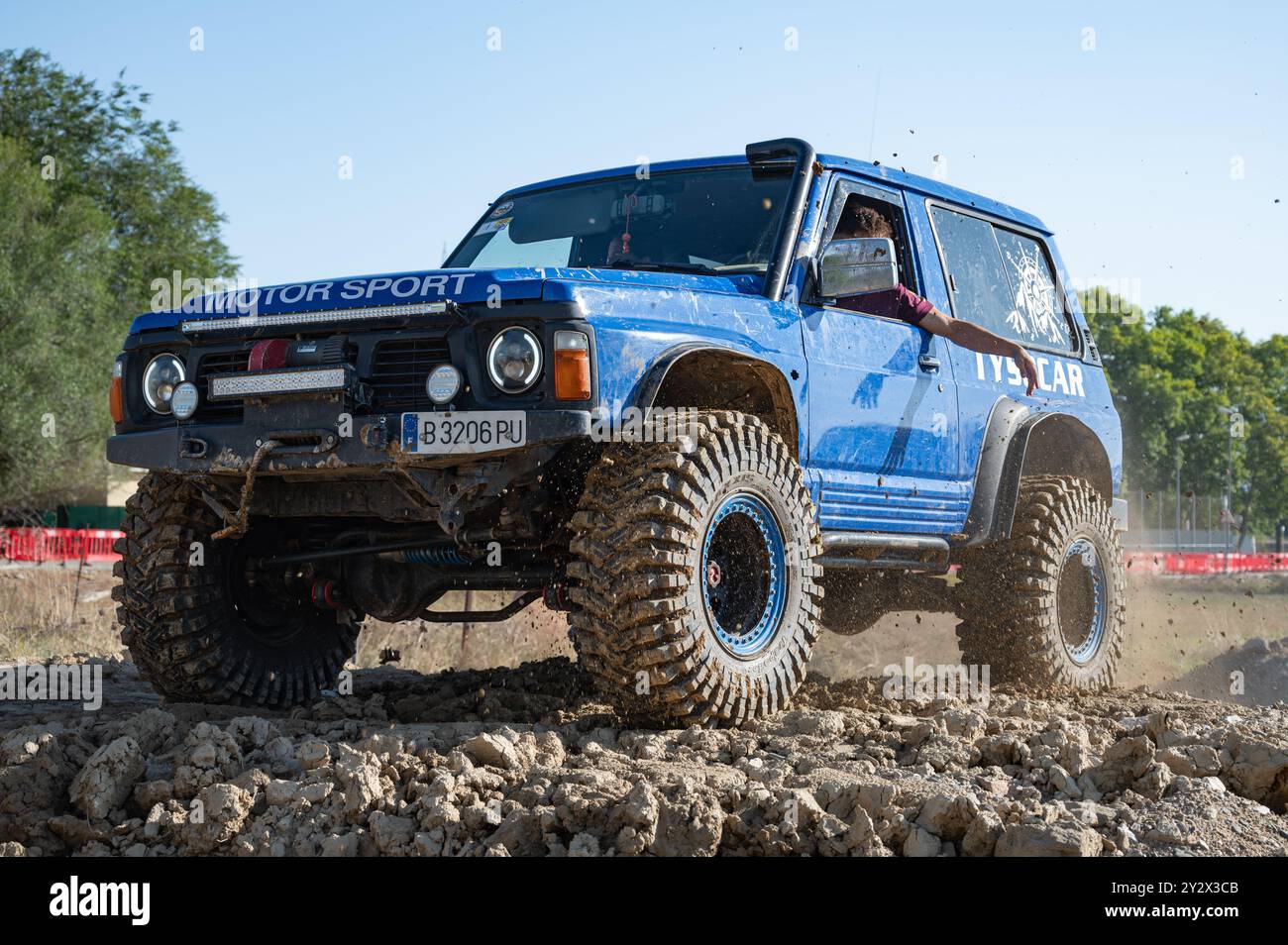 Detail of a fierce blue Nissan Patrol GR Y60 fourth generation at the ...