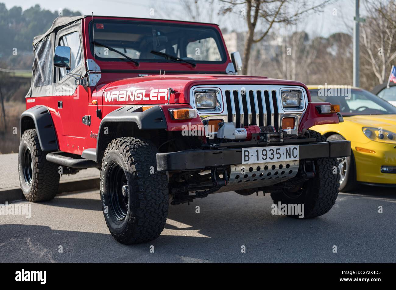 Front view of the classic red first-generation American off-road Jeep ...