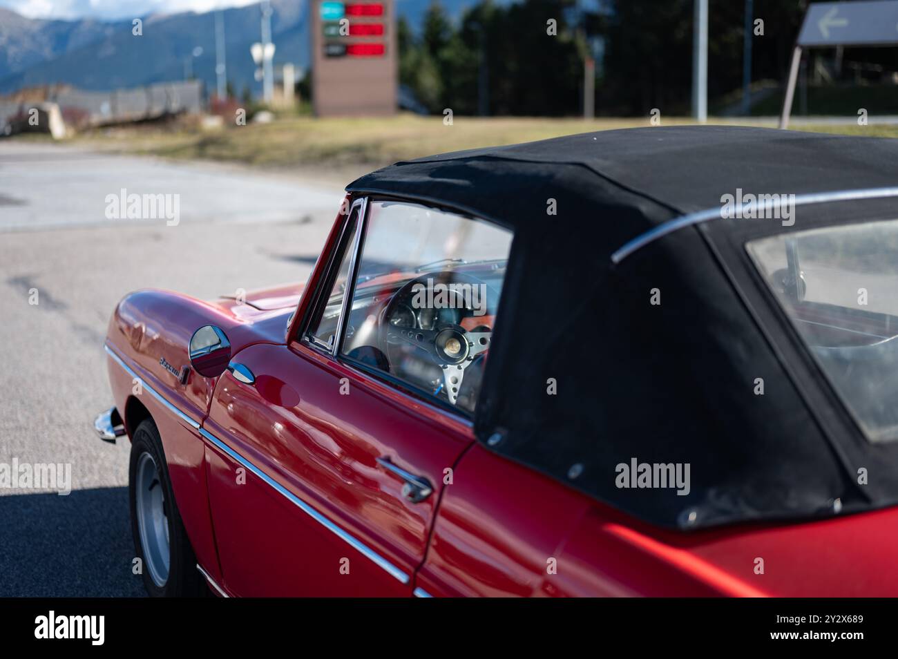 Front side detail of a red classic French convertible sports car, the ...