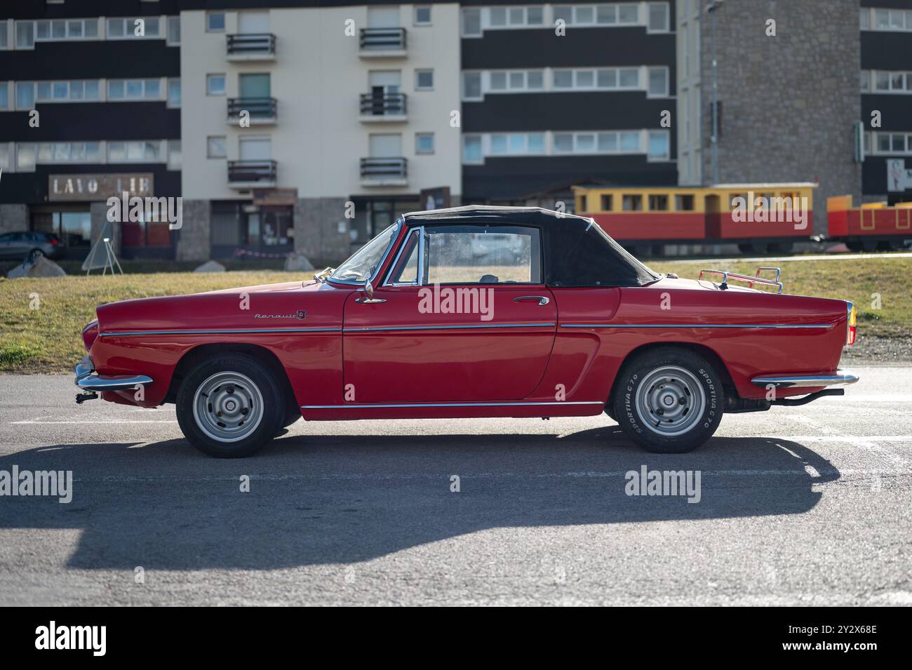 Side view of a red classic French convertible sports car, the Renault ...