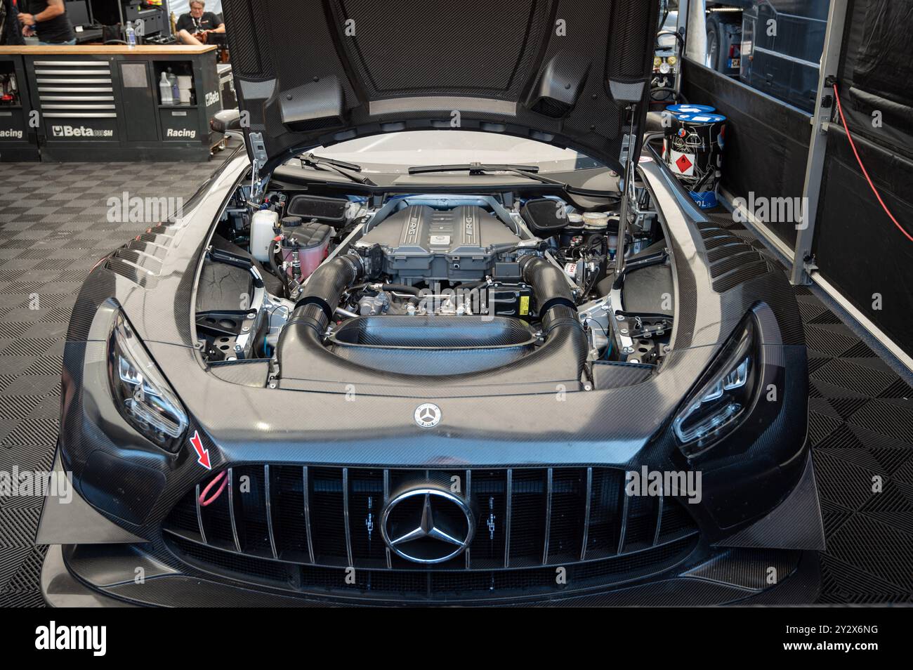 Pit tent of a GT4 European Series racing team. Detail of the engine of ...