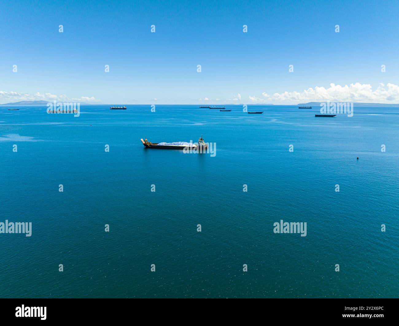 Aerial view of cargo ship in blue sea. Skyline over ocean. Mindanao ...
