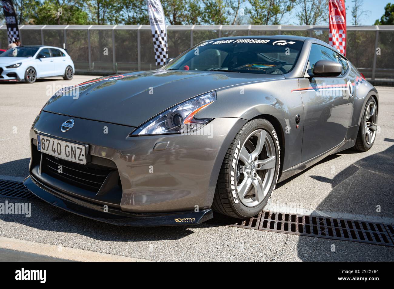 Front view of a nice gray-brown Japanese sports car Nissan 370Z. It is ...