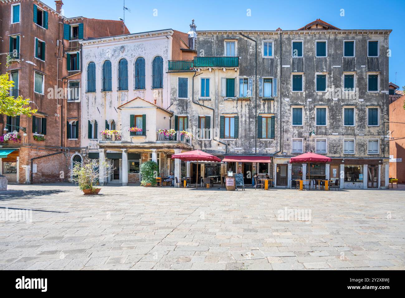 The Venetian Ghetto showcases historic architecture with vibrant cafes ...