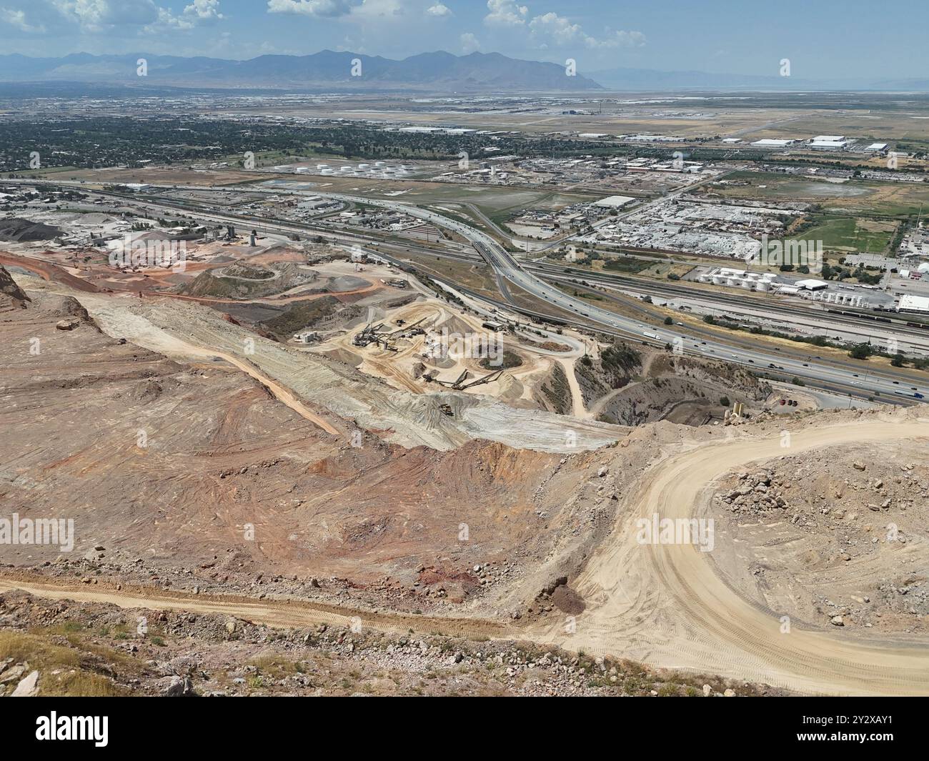 Aerial view of a quarry site with surrounding roads and industrial ...