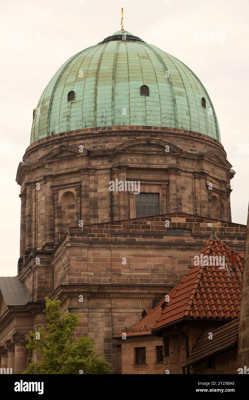 A historic building with a green dome and brick walls in Nuremberg ...