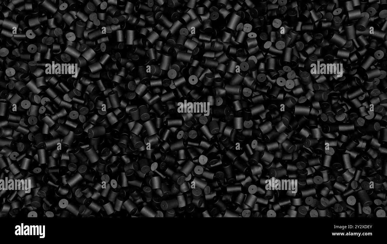 Closeup top view of black plastic polypropylene granules, masterbatch ...