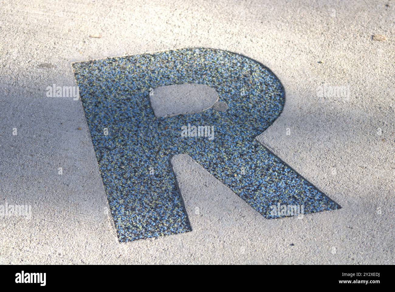 colorful alphabet letters on pavement at children's school park Stock ...