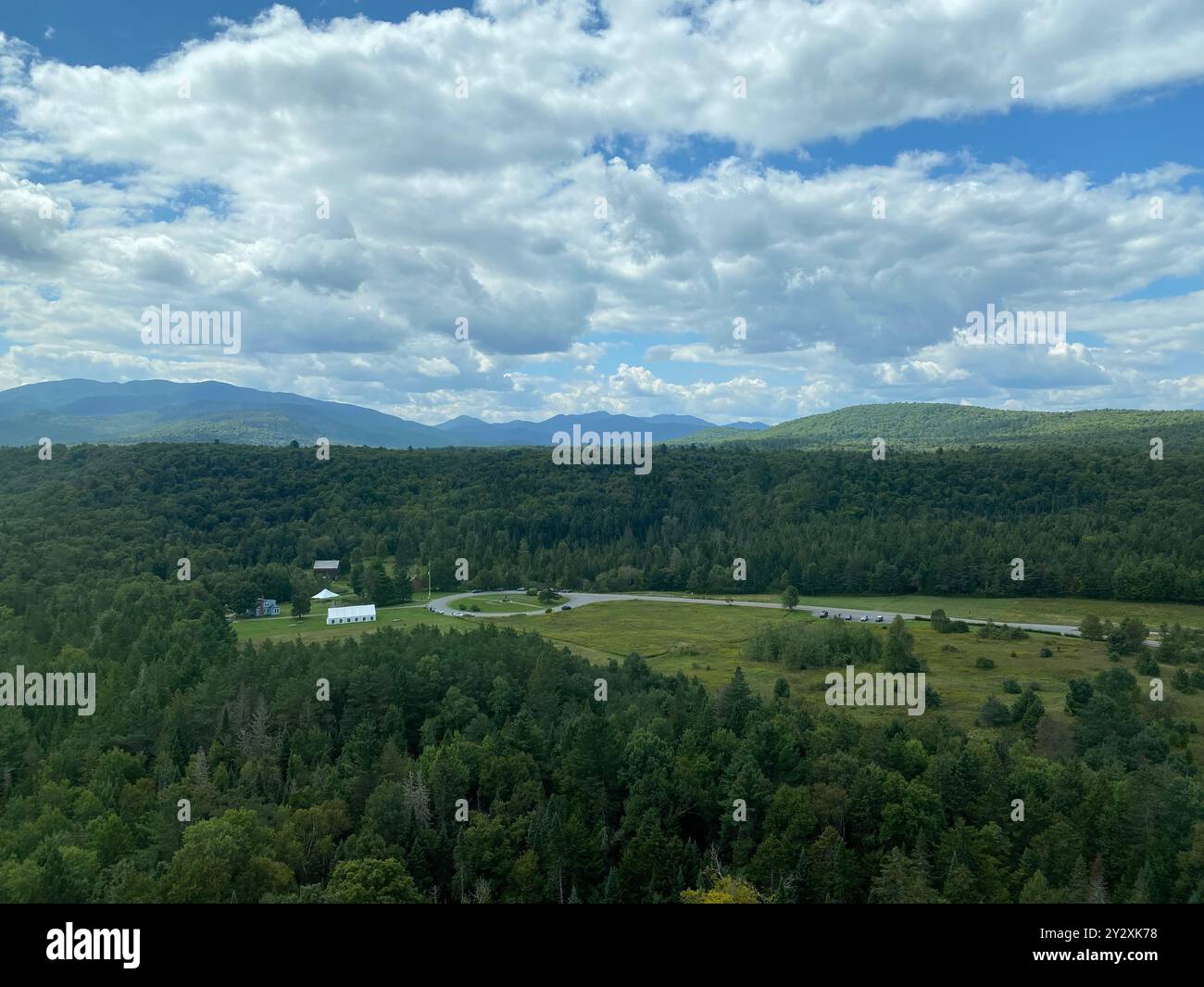 A scenic view of New England mountains with forests, trees, roads, and ...
