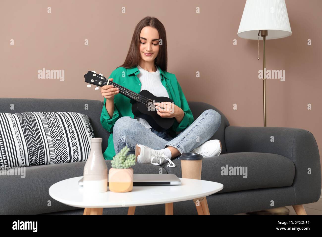 Pretty young woman ukulele hi-res stock photography and images - Alamy