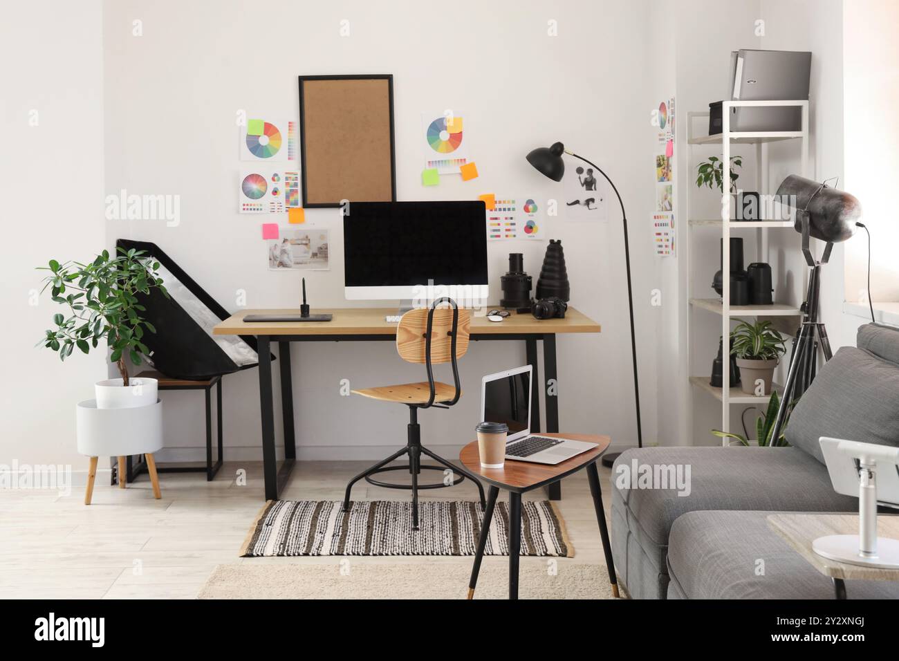 Beautiful office with workplace, modern computer and photographer ...