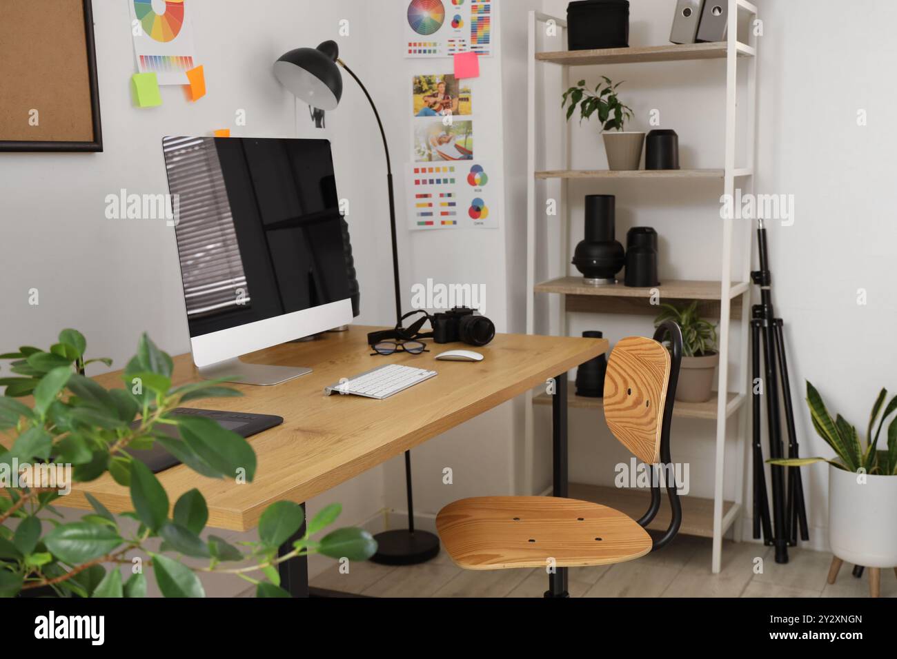 Beautiful office with workplace, modern computer and photographer ...