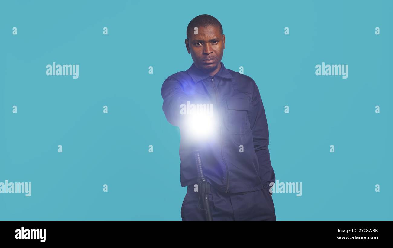 Security guard turning on flashlight, being tasked with preventing ...