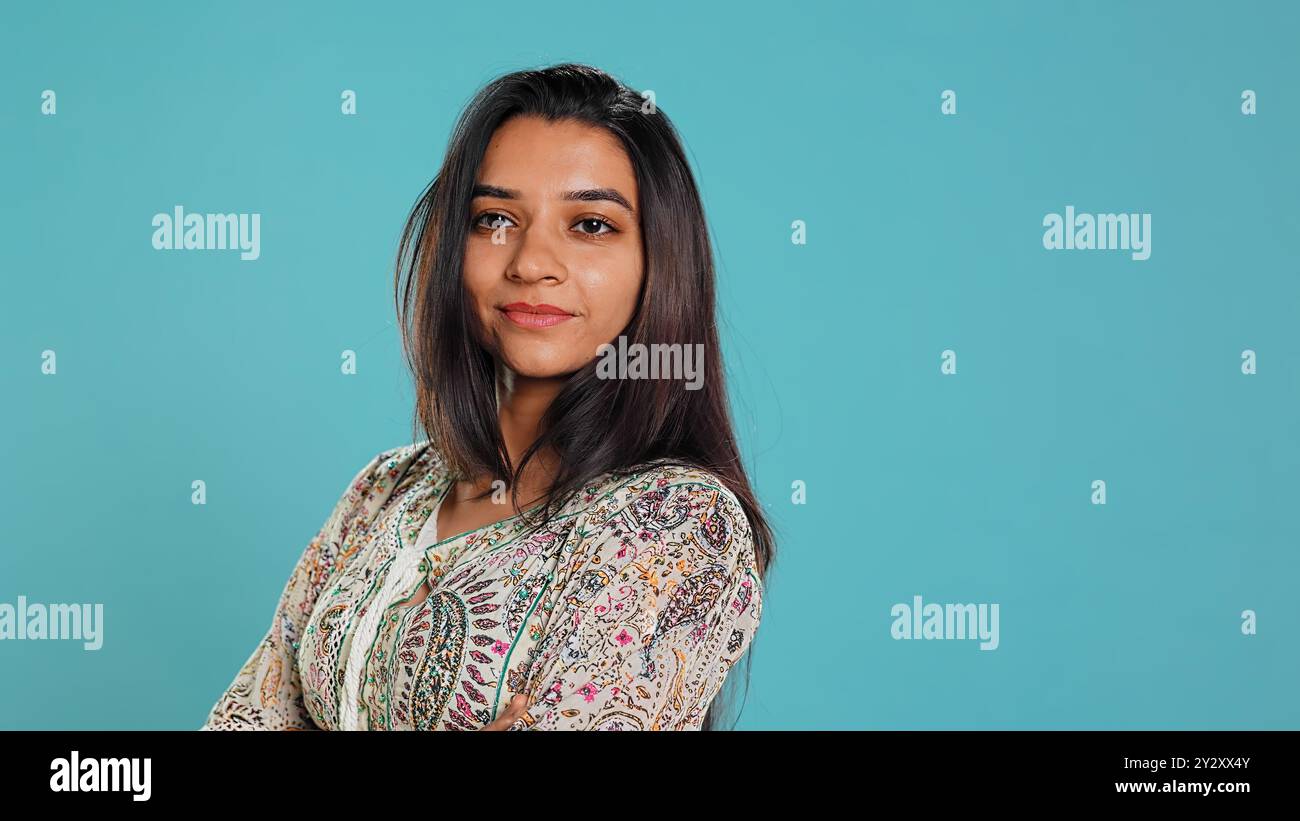 Portrait of optimistic indian woman wearing colorful clothes with ...