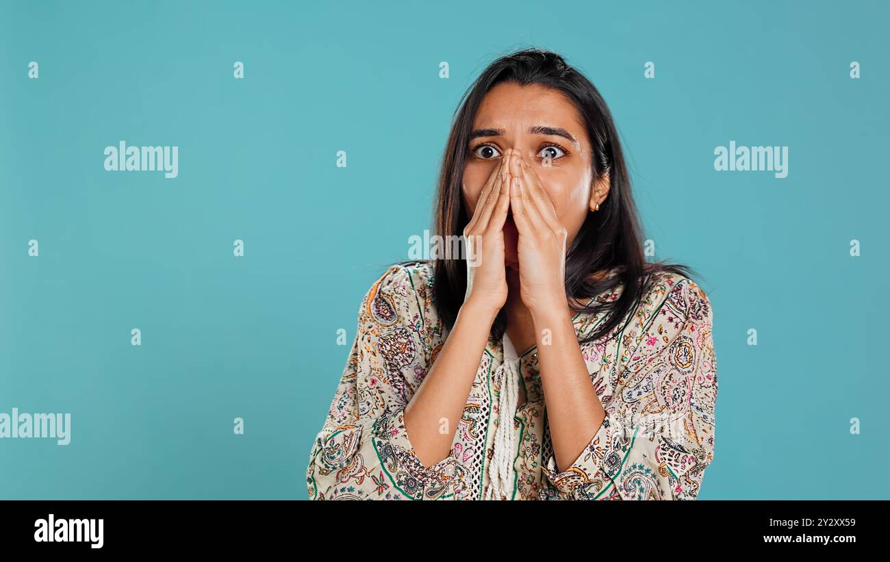 Anxious indian woman covering face with palms, worried about future ...