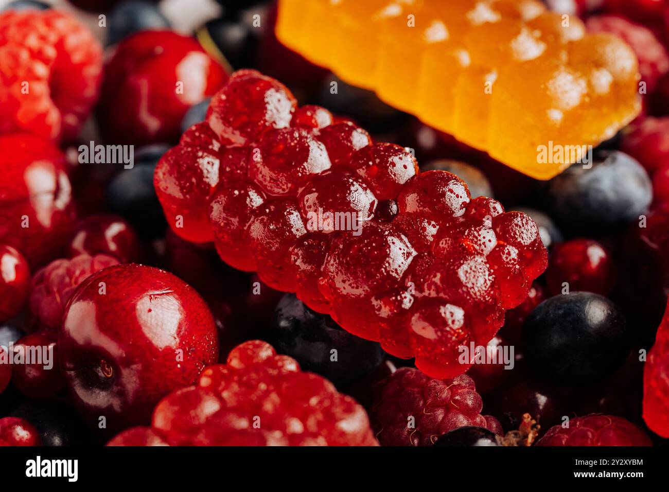 Colorful natural berry marmalade on fresh mixed fruits and berries ...