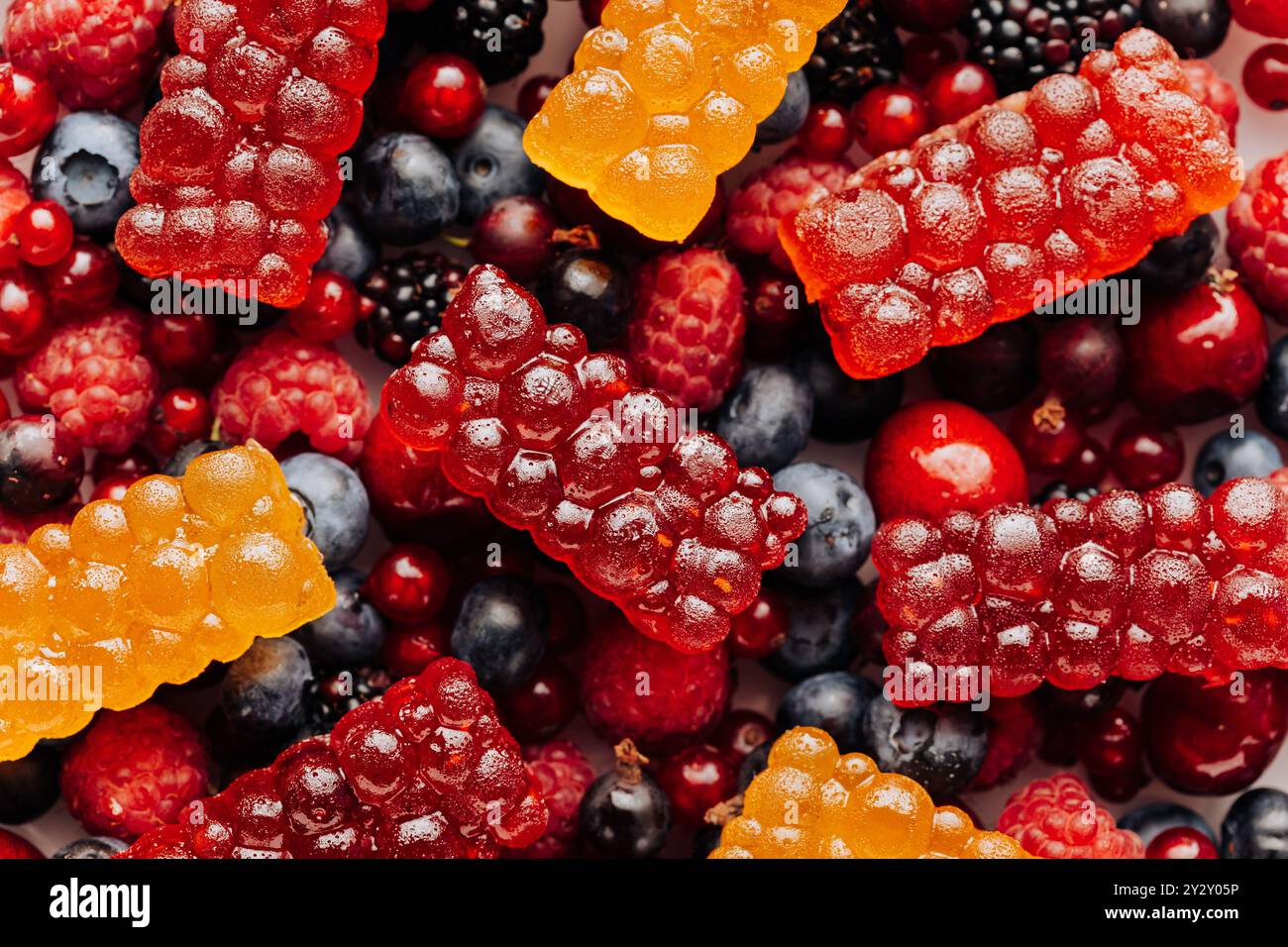 Colorful natural berry marmalade on fresh mixed fruits and berries ...