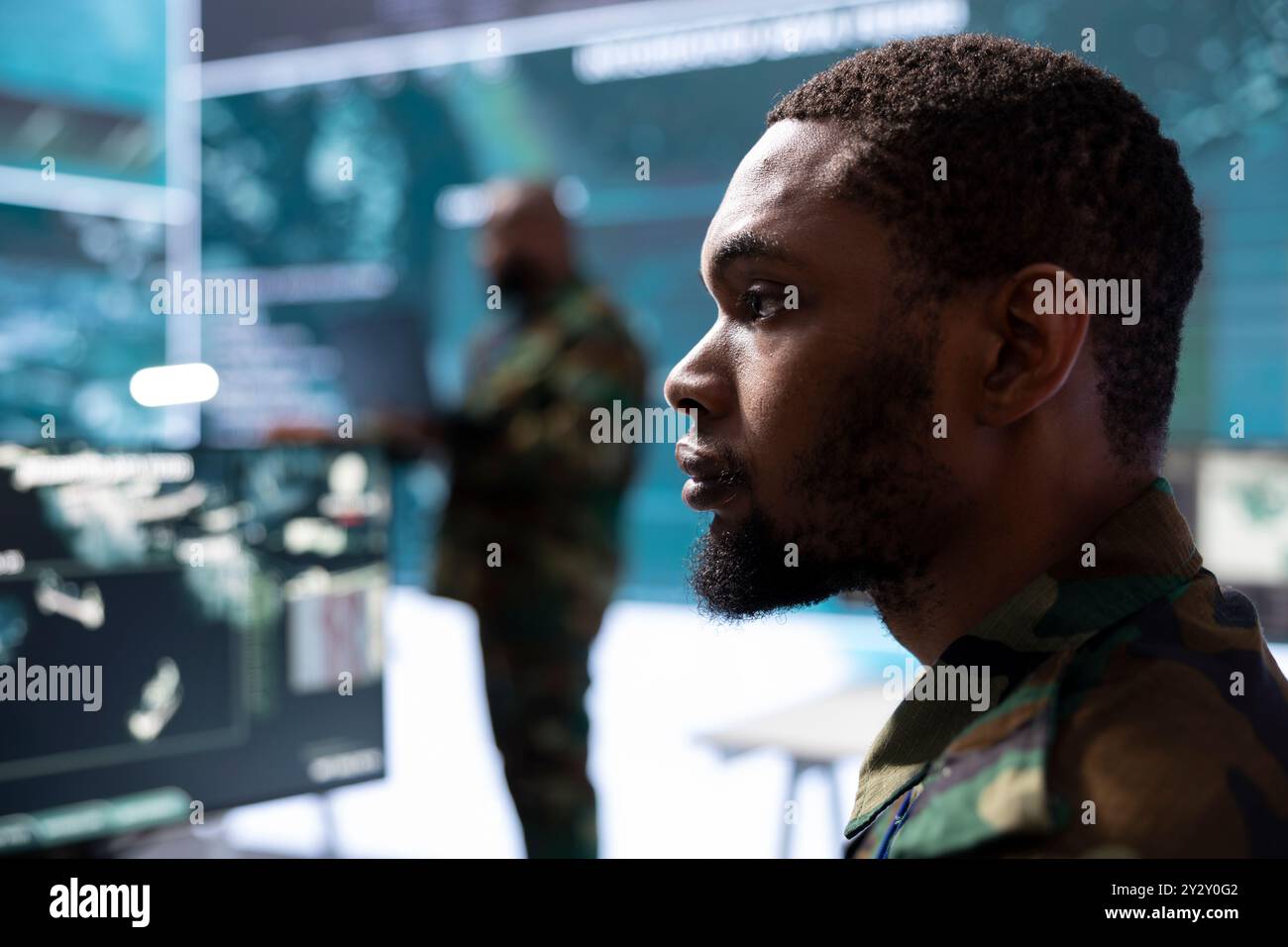Government intelligence officer in control center manages surveillance ...