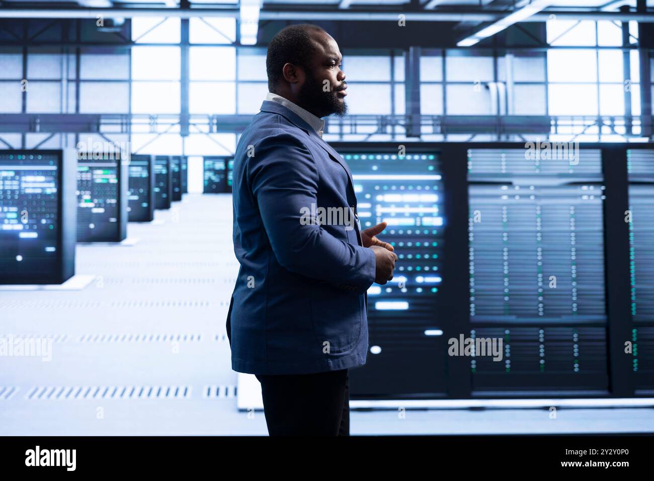 Engineer walking through server racks hi-res stock photography and images - Alamy