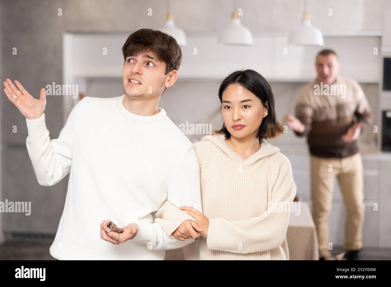 Young married couple leaves home, leaving father alone at home Stock ...