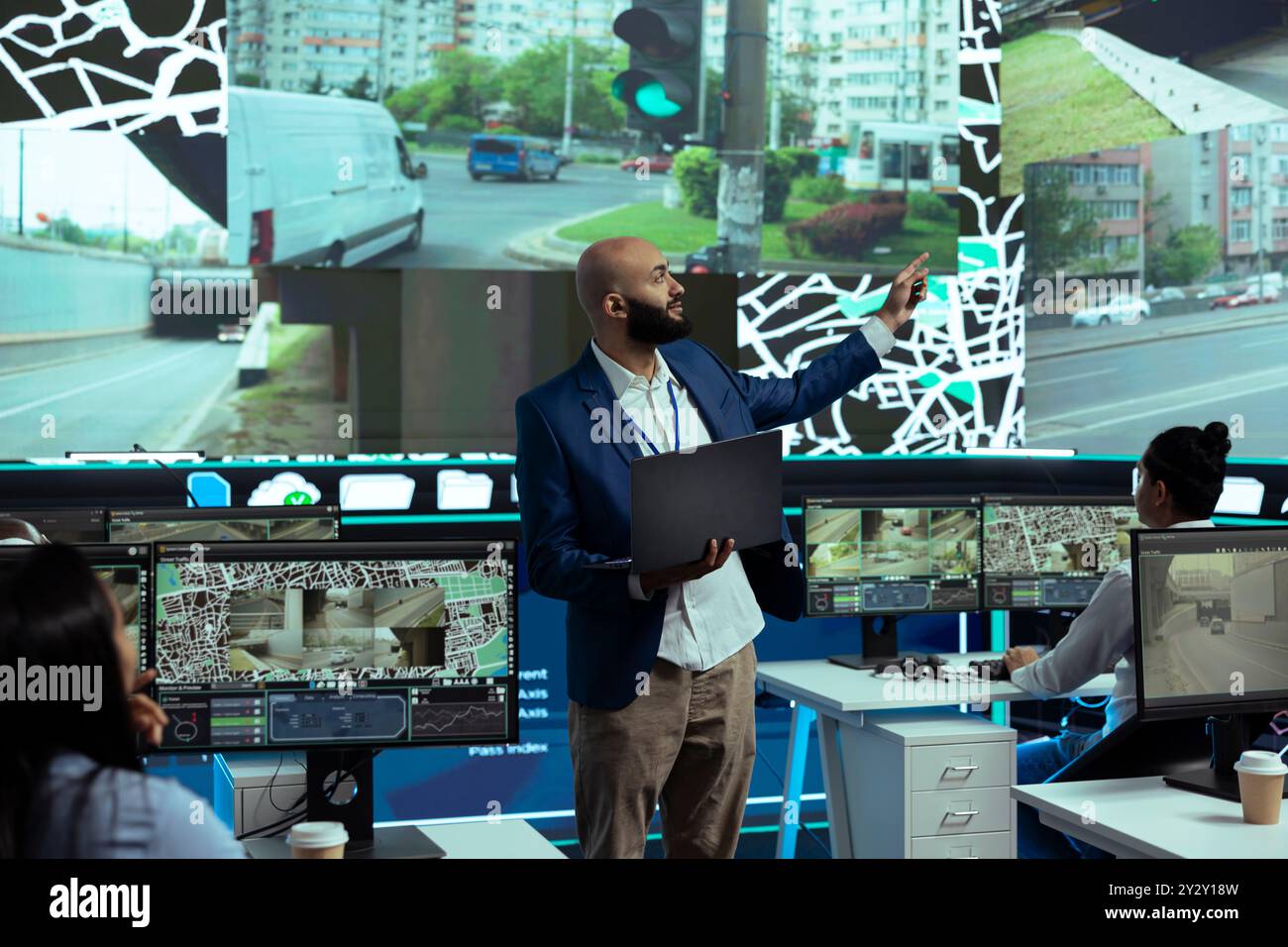 Middle eastern manager instructing his staff to help couriers with ...