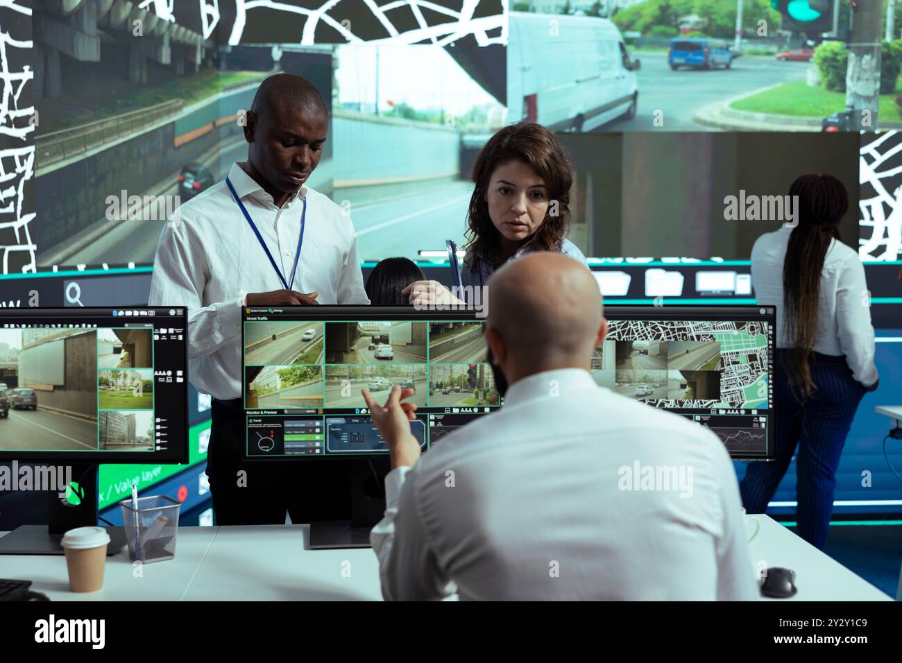 Diverse team leaders instructing middle eastern employee about order ...