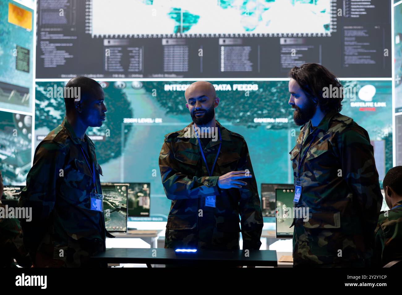 Diverse team of troopers discussing new mission attack plan in control ...