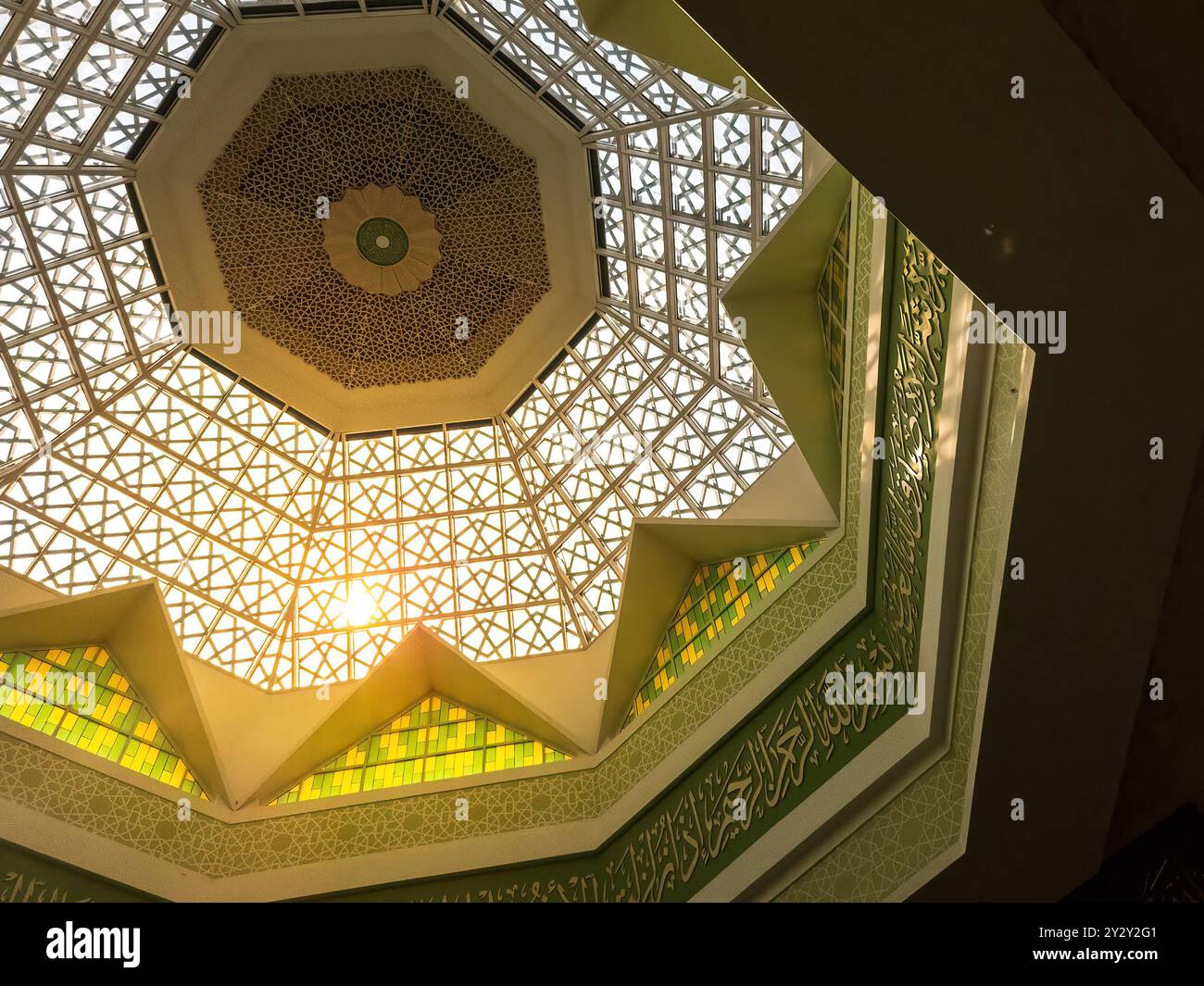 Intricate dome ceiling with geometric patterns and Arabic calligraphy ...