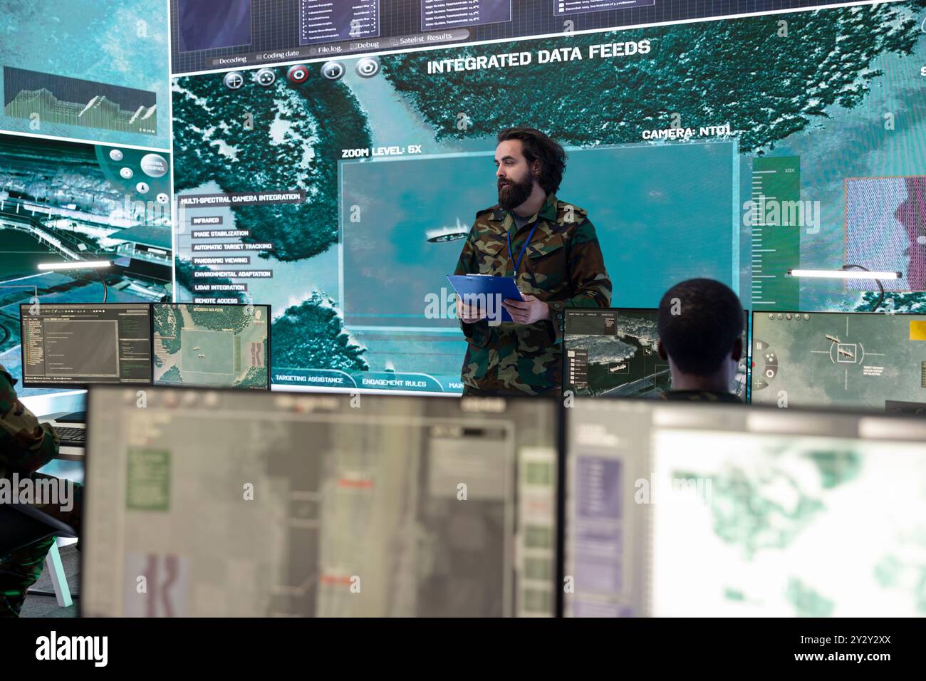 Special operations engineer examines a world map with gps tracking ...