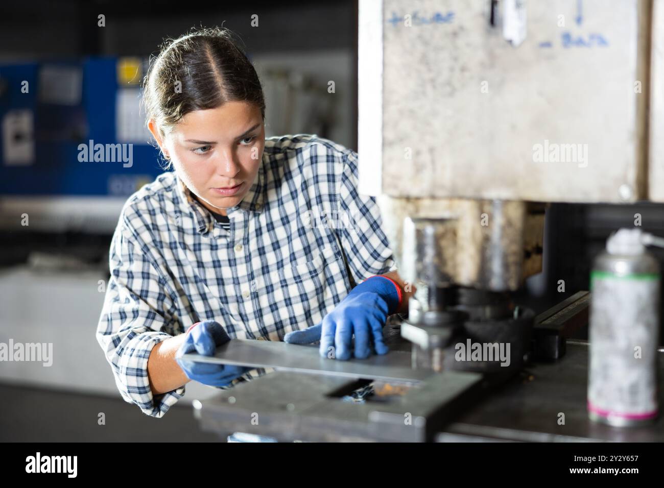 Worker punching holes in metal hi-res stock photography and images - Alamy