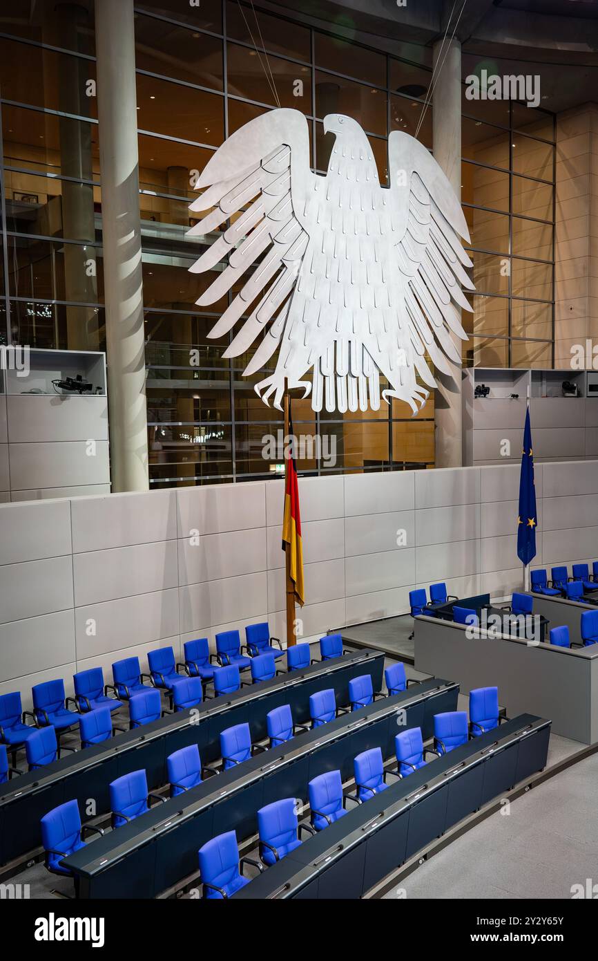 Interior of the German Bundestag parliament building with rows of blue ...