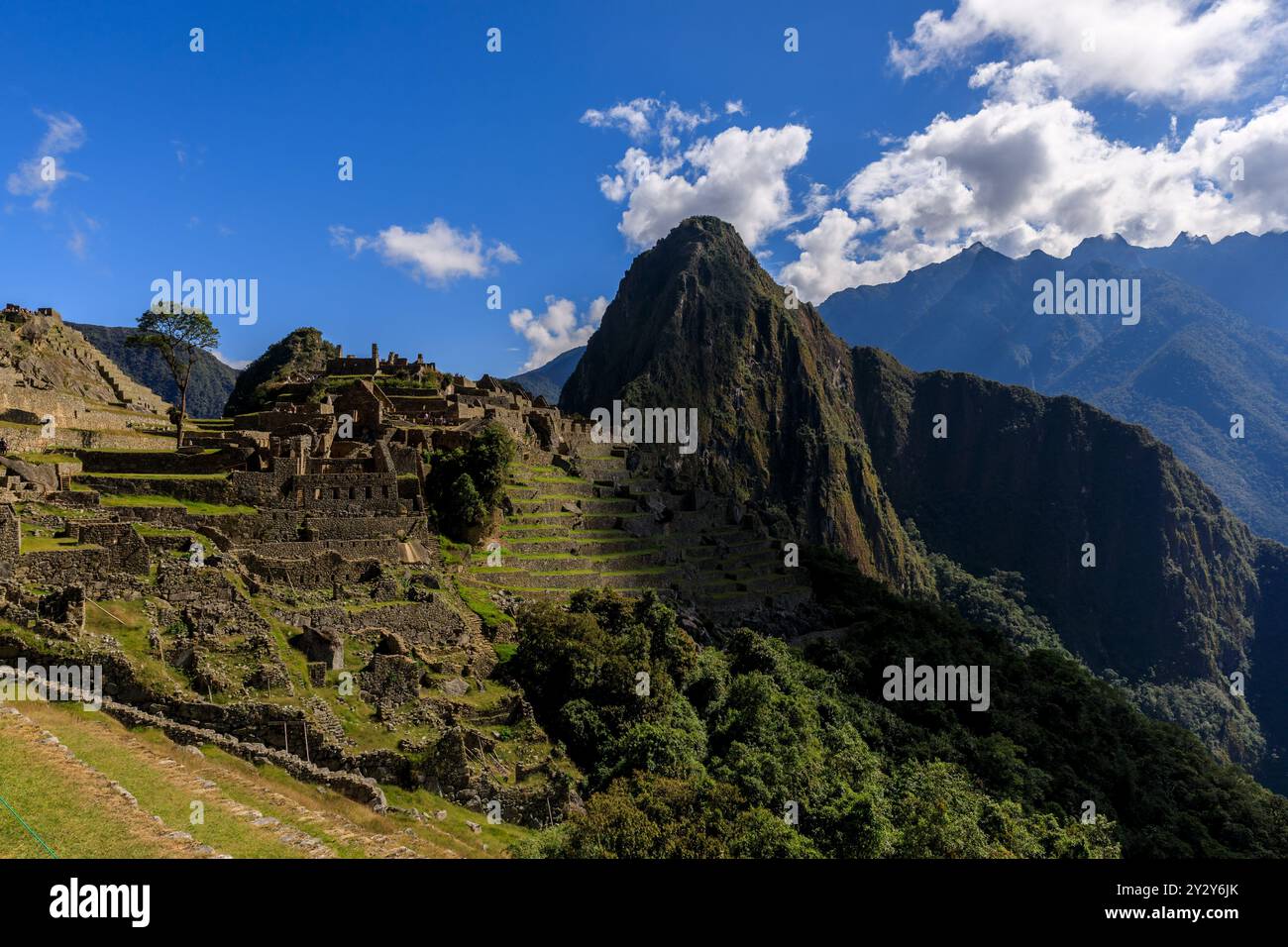 A stunning view of Machu Picchu with clear blue skies and mountain ...