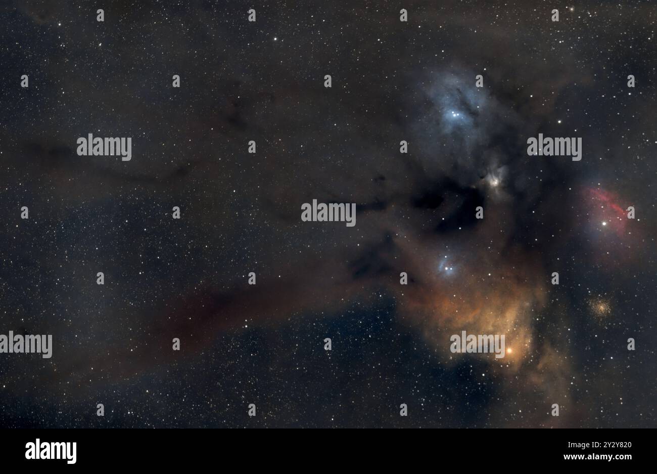 A scenic view of Antares and the Rho Ophiuchi cloud in the night sky ...