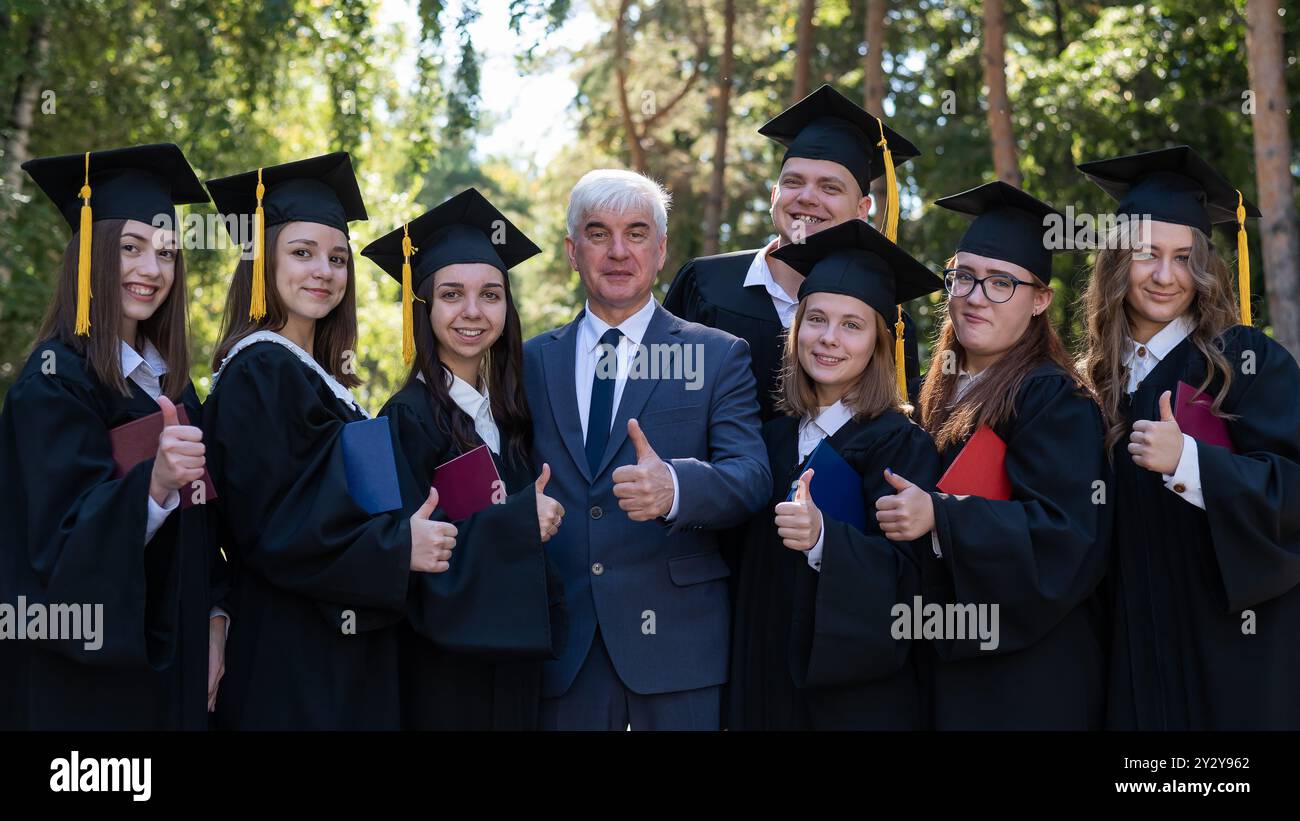 University professor and seven students rejoice at graduation and show ...