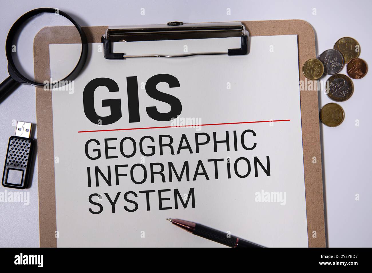 GIS - Geographic Information System acronym on notepad, concept ...