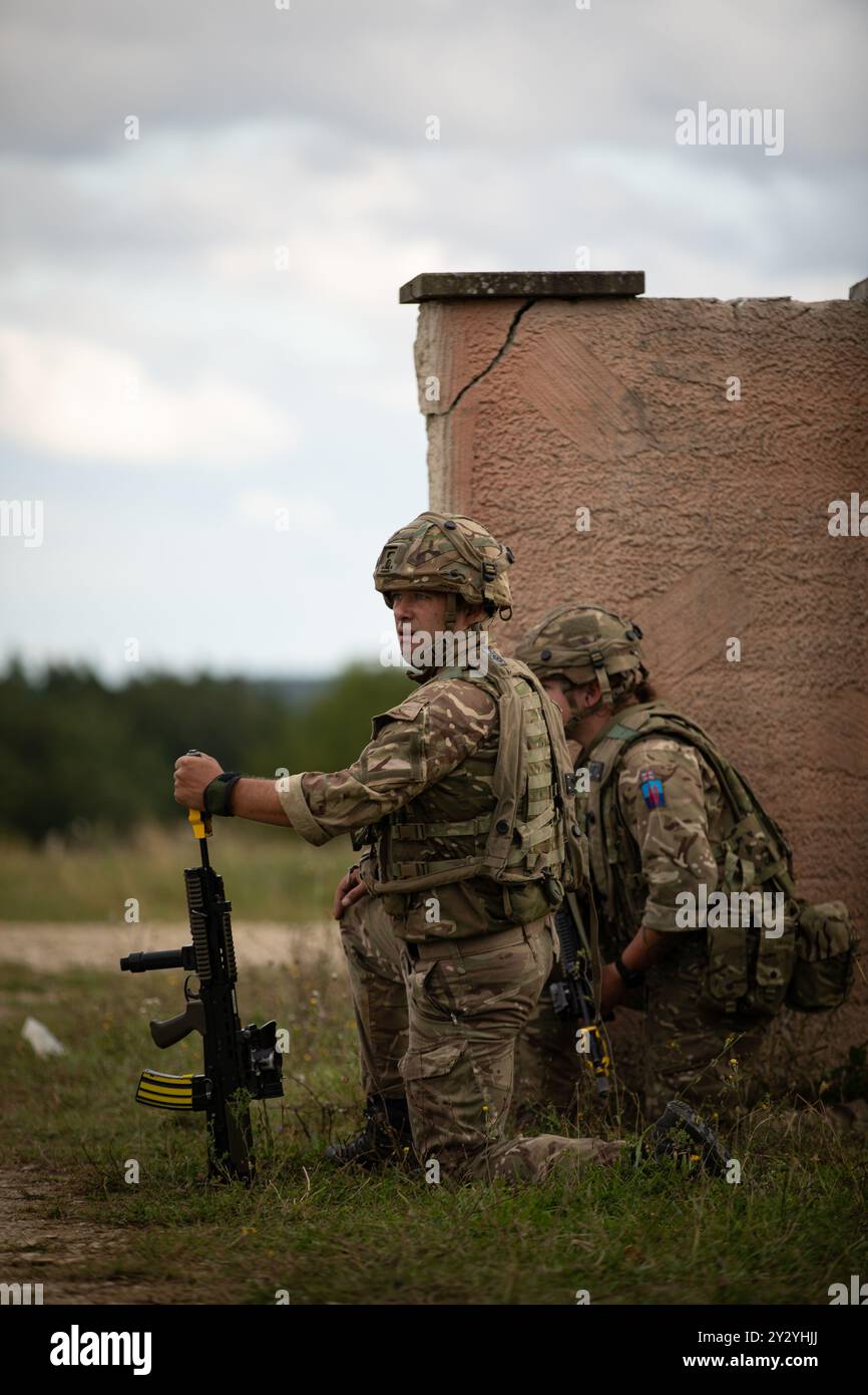 British soldiers take cover after contact with opposing forces during ...