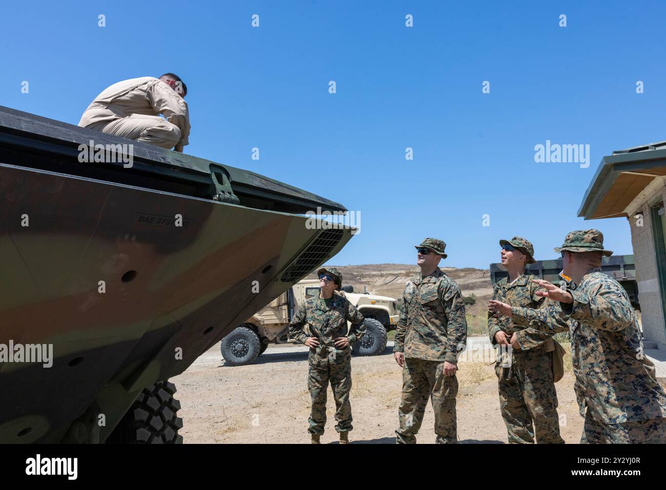 U.S. Marines with 1st Marine Division familiarize themselves with an ...