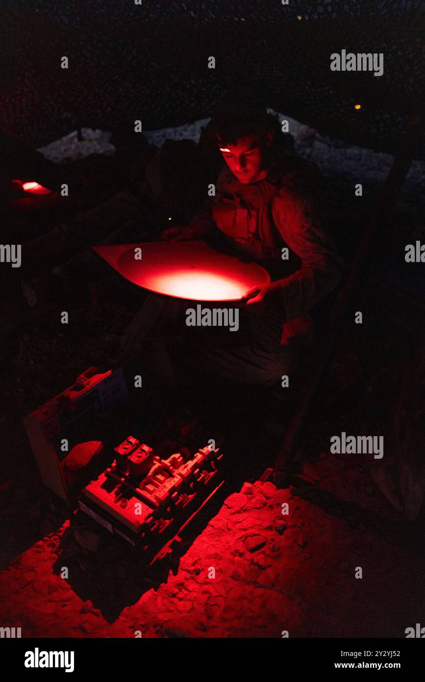 U.S. Marine Corps Lance Cpl. Chandler Sneed, the primary plotter with ...