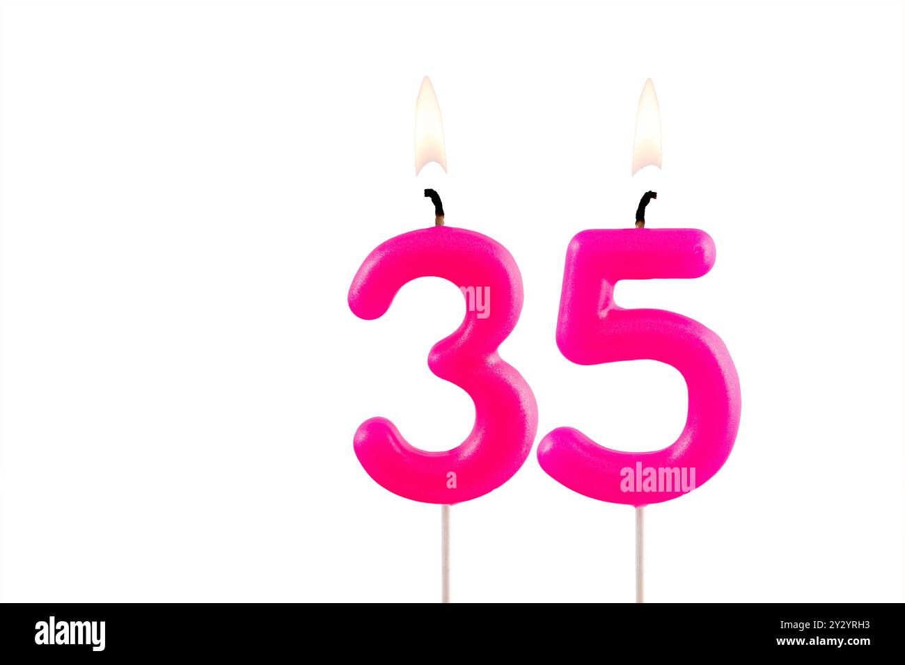 Pink number 35 birthday candle on white background Stock Photo - Alamy