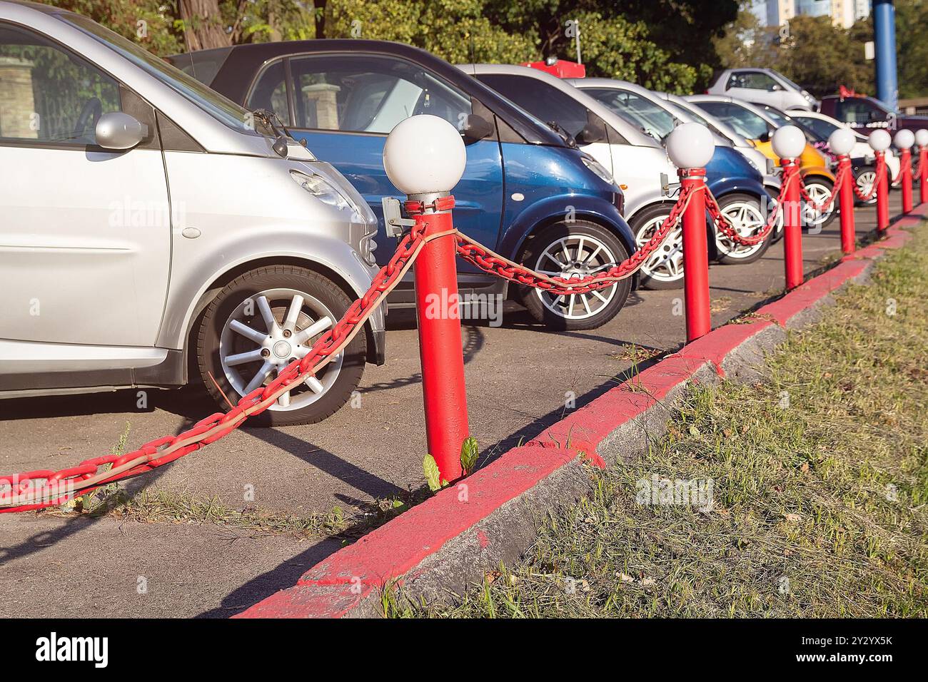Rental cars stand in a row in the parking lot. Transport Stock Photo ...