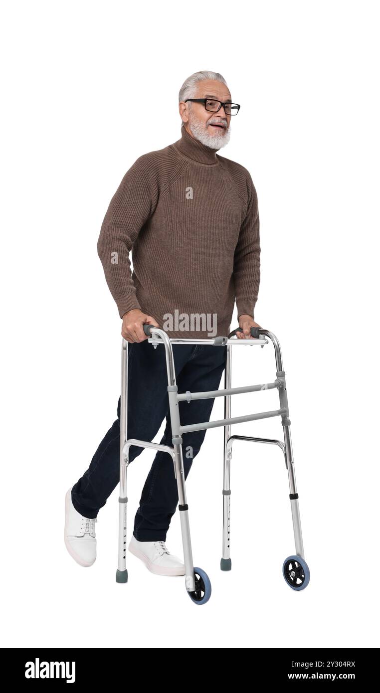 Senior man using walking frame on white background Stock Photo - Alamy