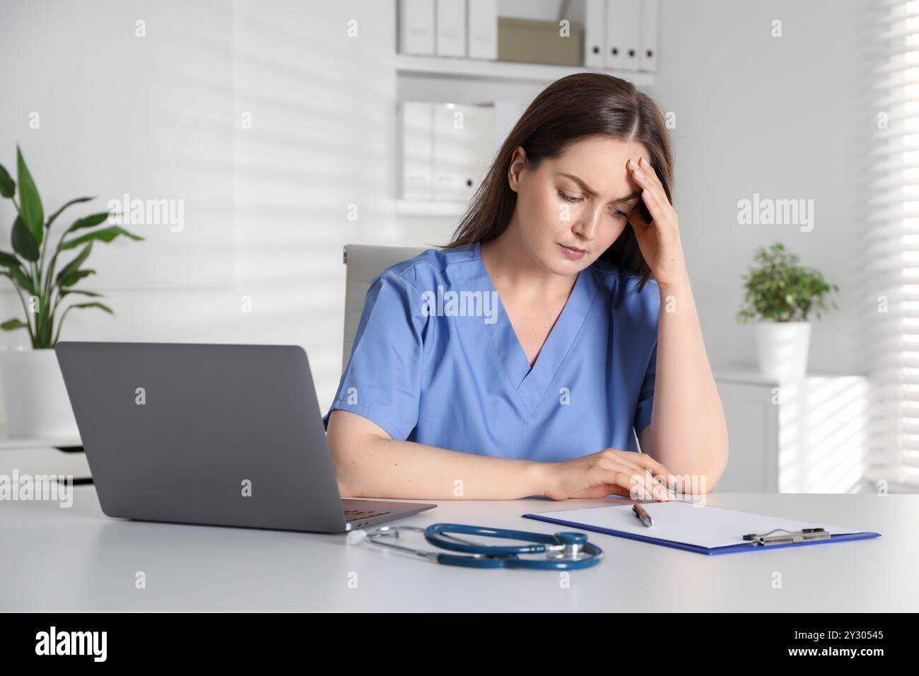 Tired specialist working in hi-res stock photography and images - Alamy