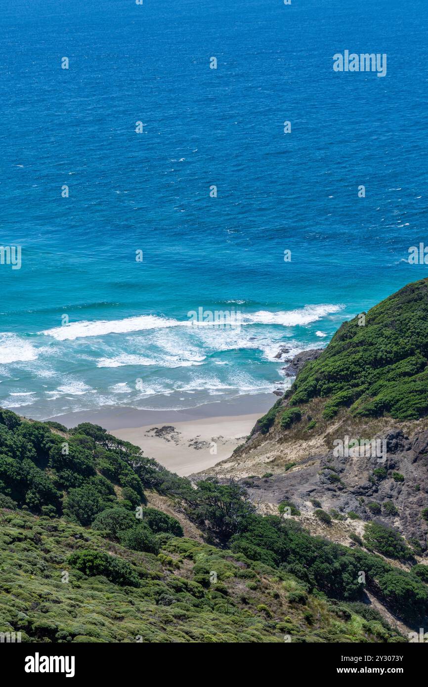 An aerial view of a small hidden rocky cove on the Pacific Ocean side ...