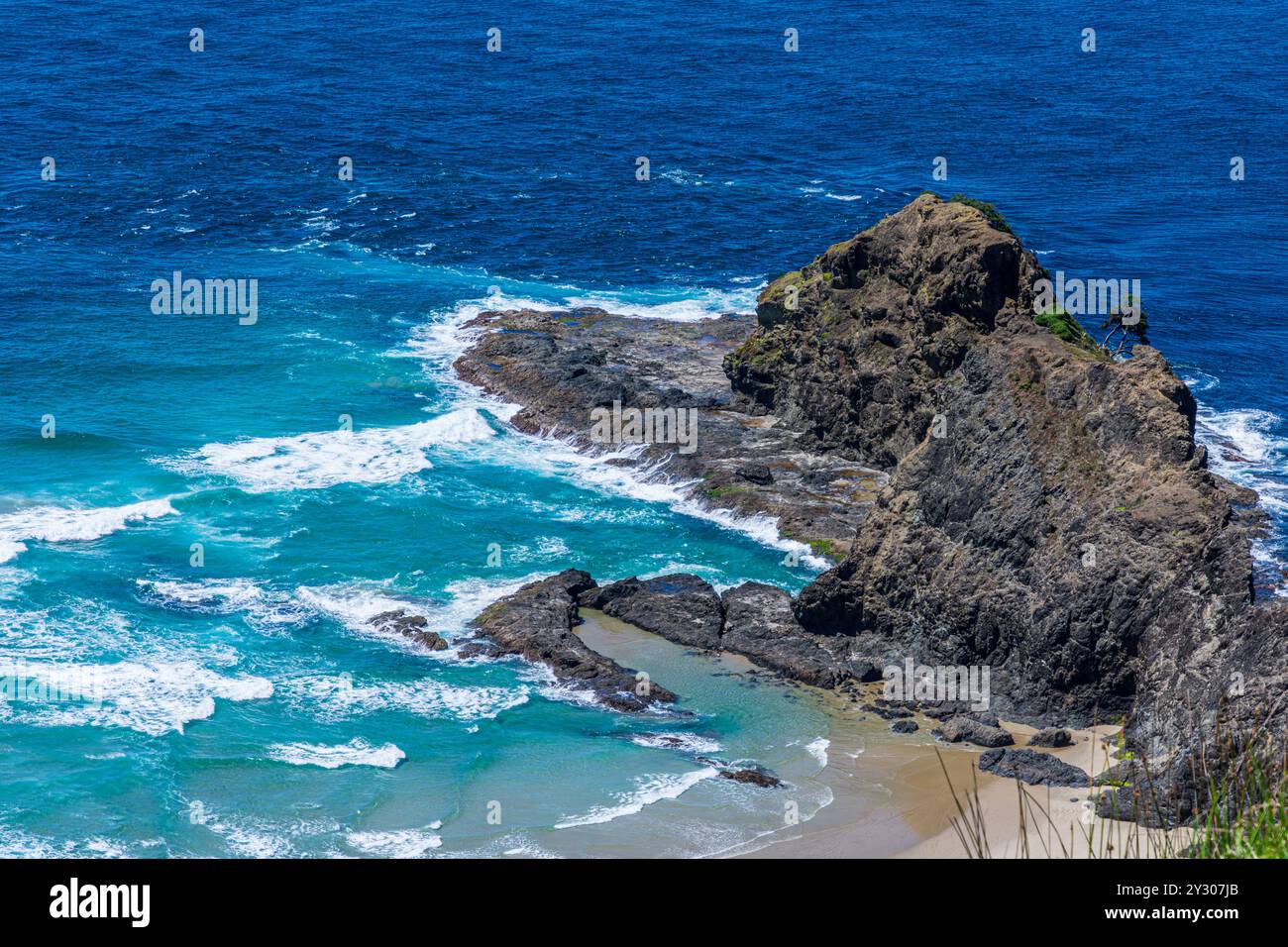 An aerial view of a rocky outcrop on a beach jutting into the sea Stock ...
